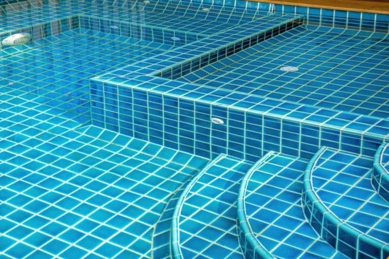 18 Swimming Pool Tile Designs That Elevate Backyard Style